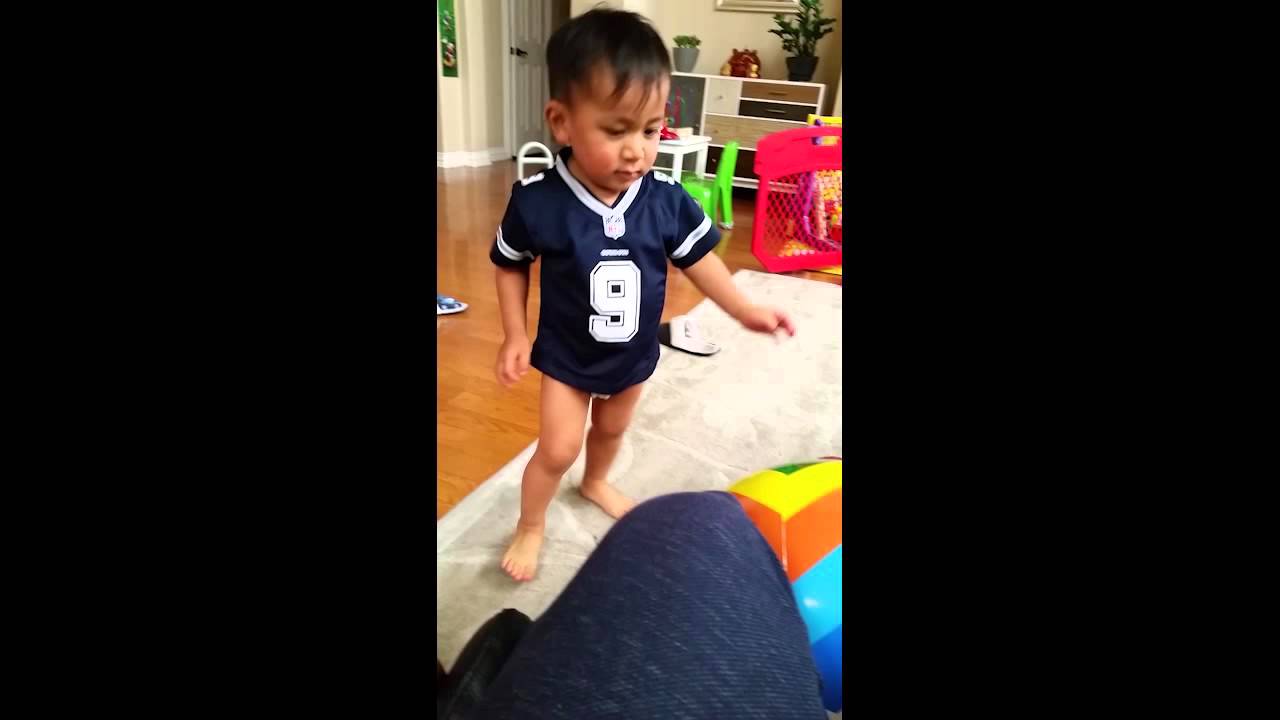 Cute baby tries to kick a balloon and hits head - YouTube