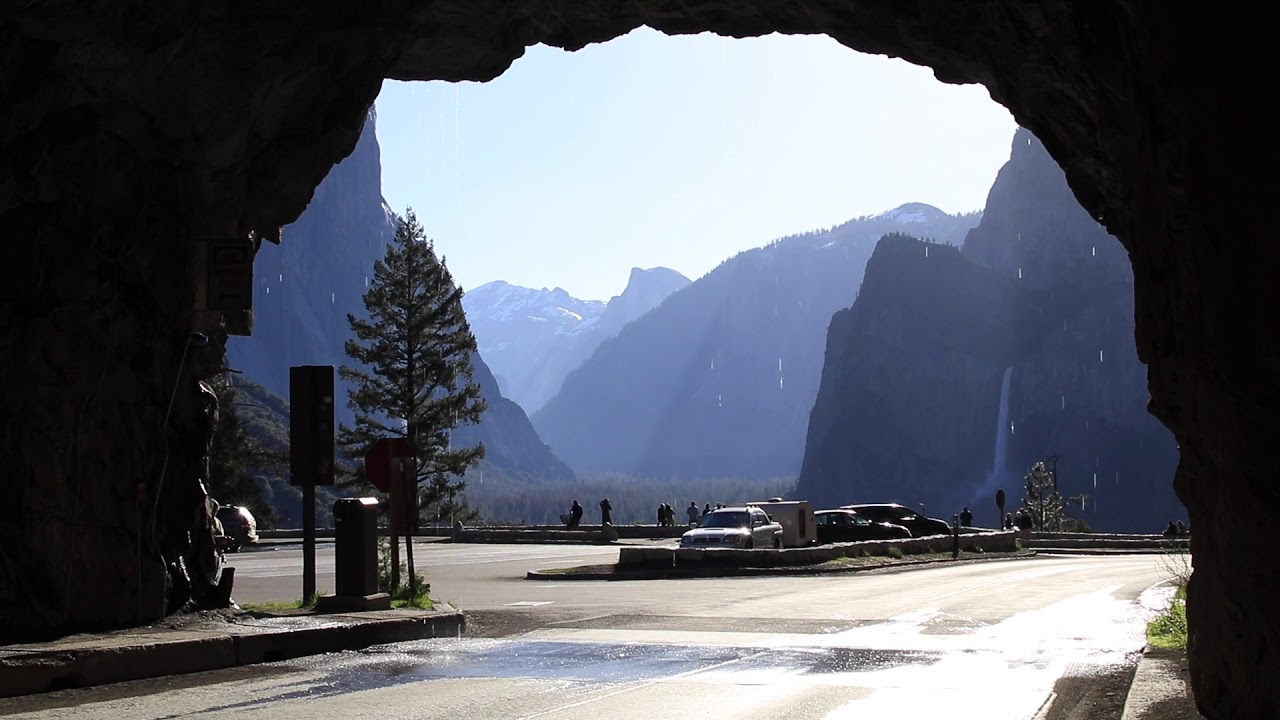 tunnel on the road with amazing view of the mountains - YouTube