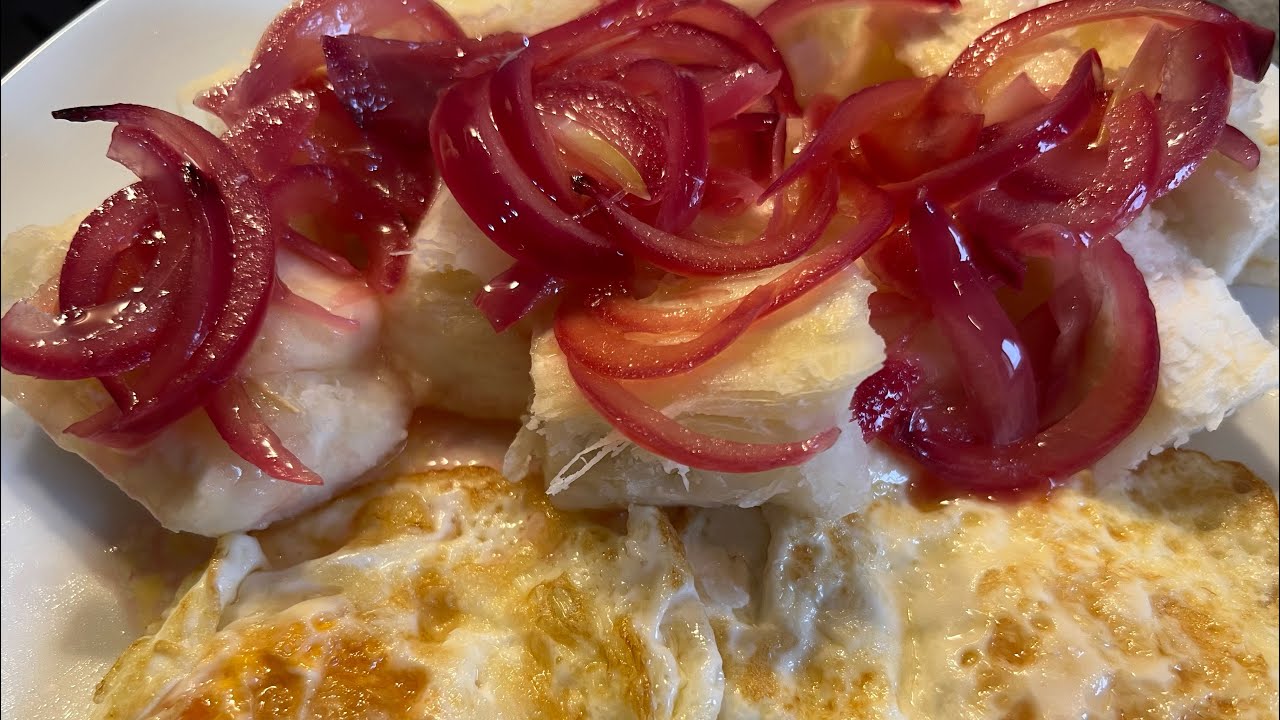 Yuca Con Huevo Typical Peruvian Dish Of Fried Egg With Fish, Yuca, And