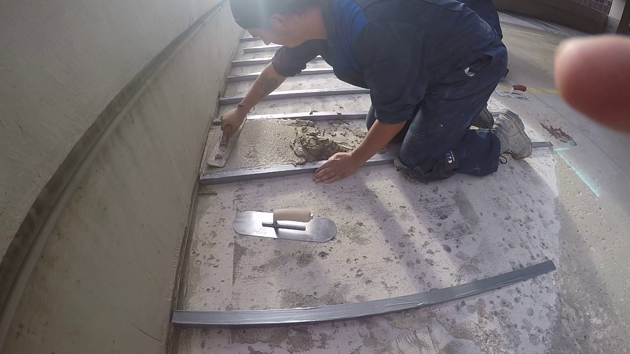 Resloping begins on parkade floors - YouTube