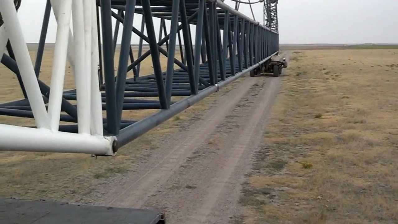 Demag TC2000 moving with 200' main boom and luffer base on a wind farm ...