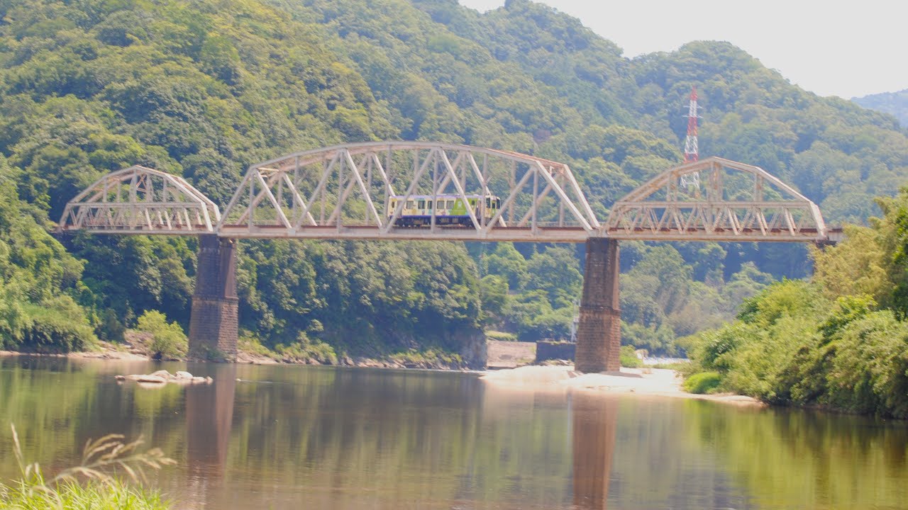 JR Kansai Line diesel trains crossing Kizu River Bridge between Okawara ...