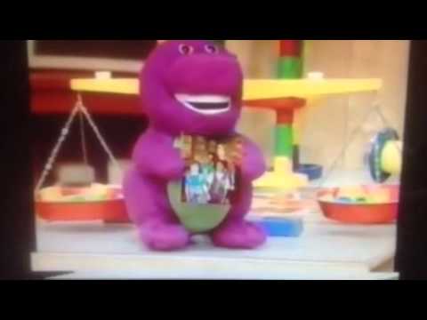Barney doll with a picture of Friends in Caring Means Sharing - YouTube
