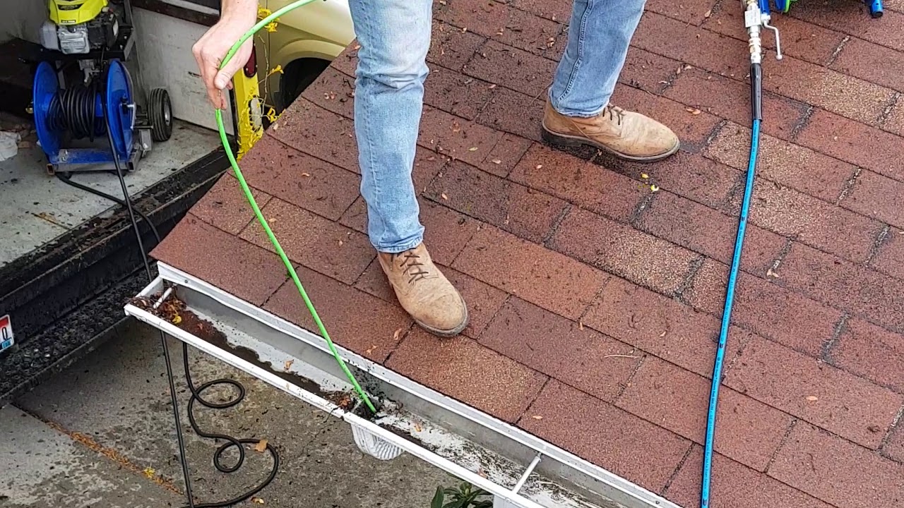 Cleaning a gutter and downspout using a hydro jet in Spokane Valley ...