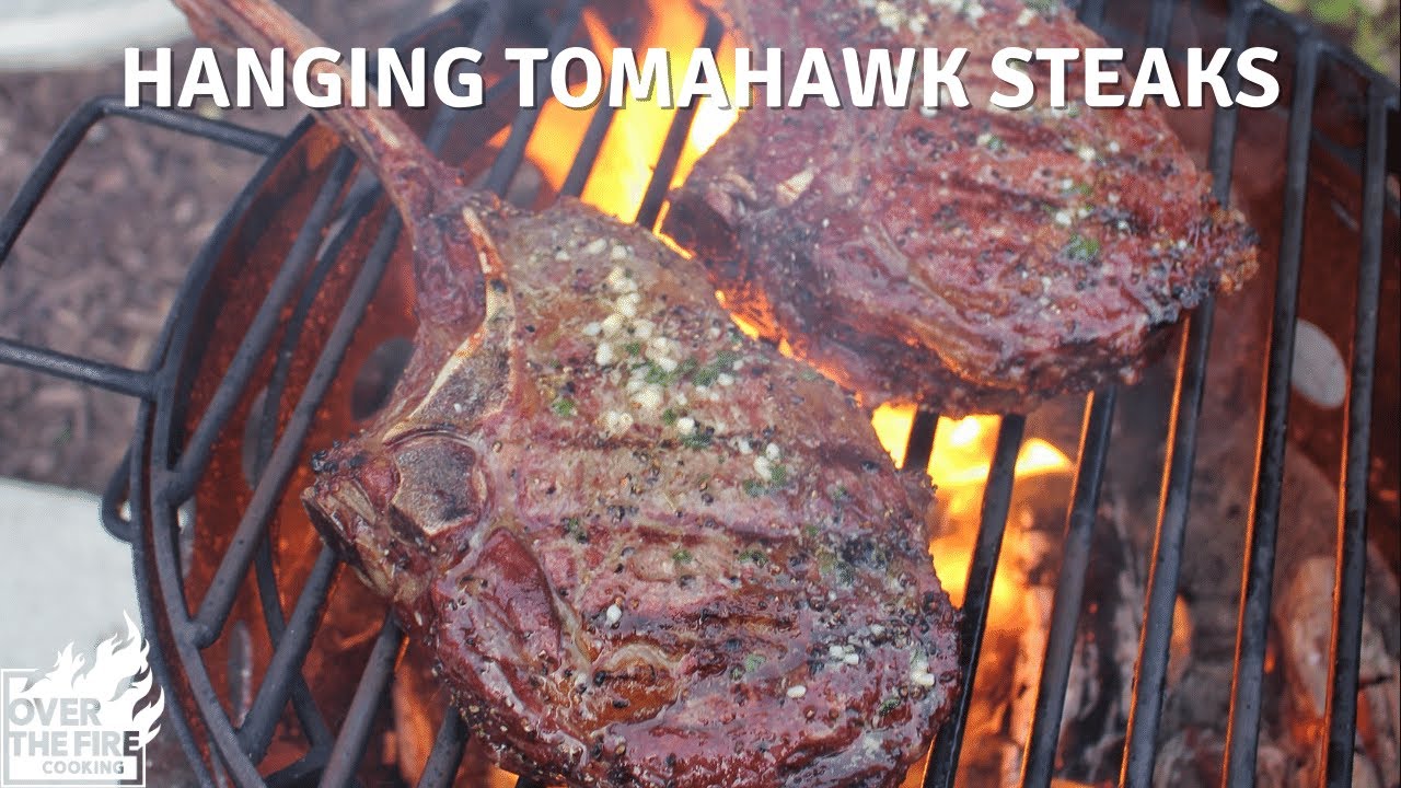 Hanging TOMAHAWK Steaks! 🥩 🌿 🔥 | Over The Fire Cooking #shorts - YouTube