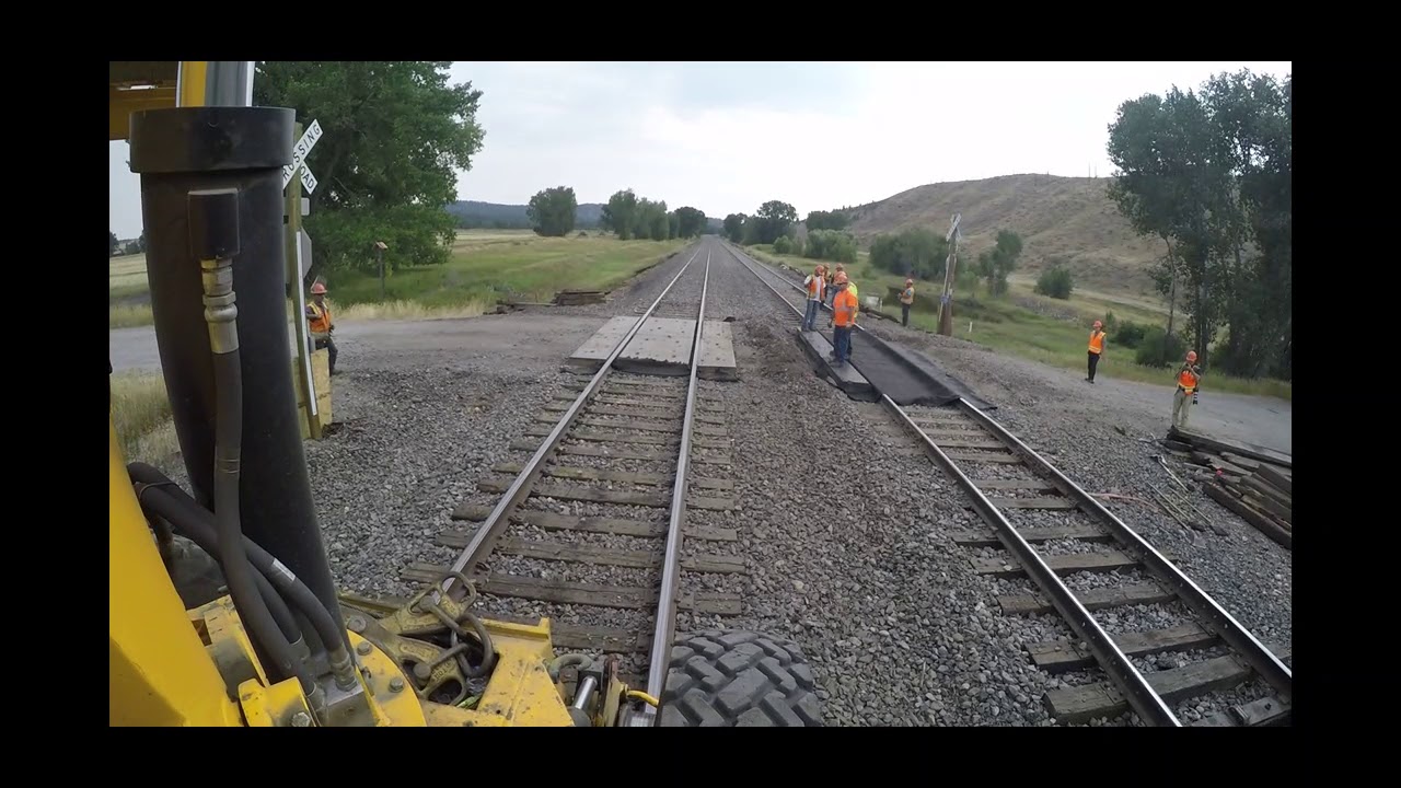 Pettibone Speed Swing lays a crossing mat in high-rail mode - YouTube