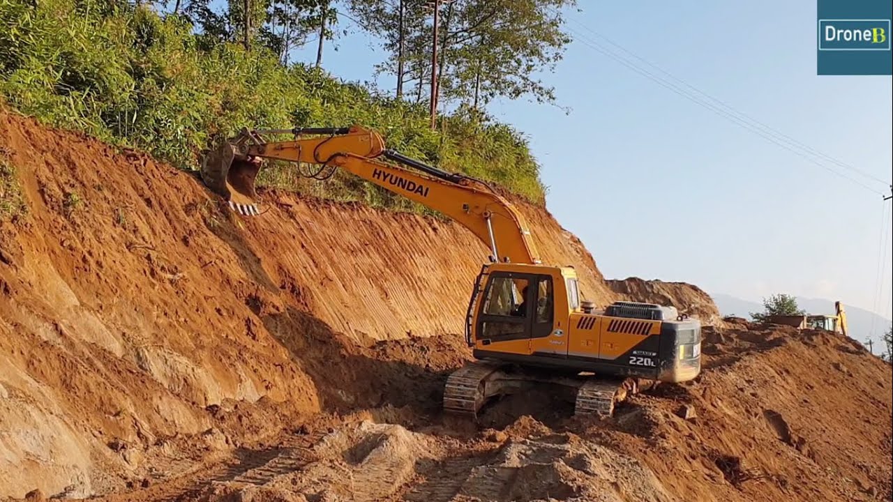 Final Touch for a Hilly Slope-Hyundai Excavator-Hilly Road Construction ...
