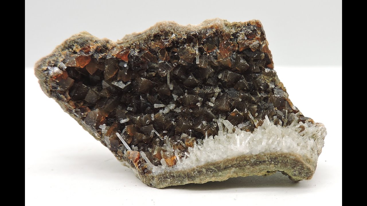 Natrolite needles and calcite in petrified wood from Uganda – rare ...