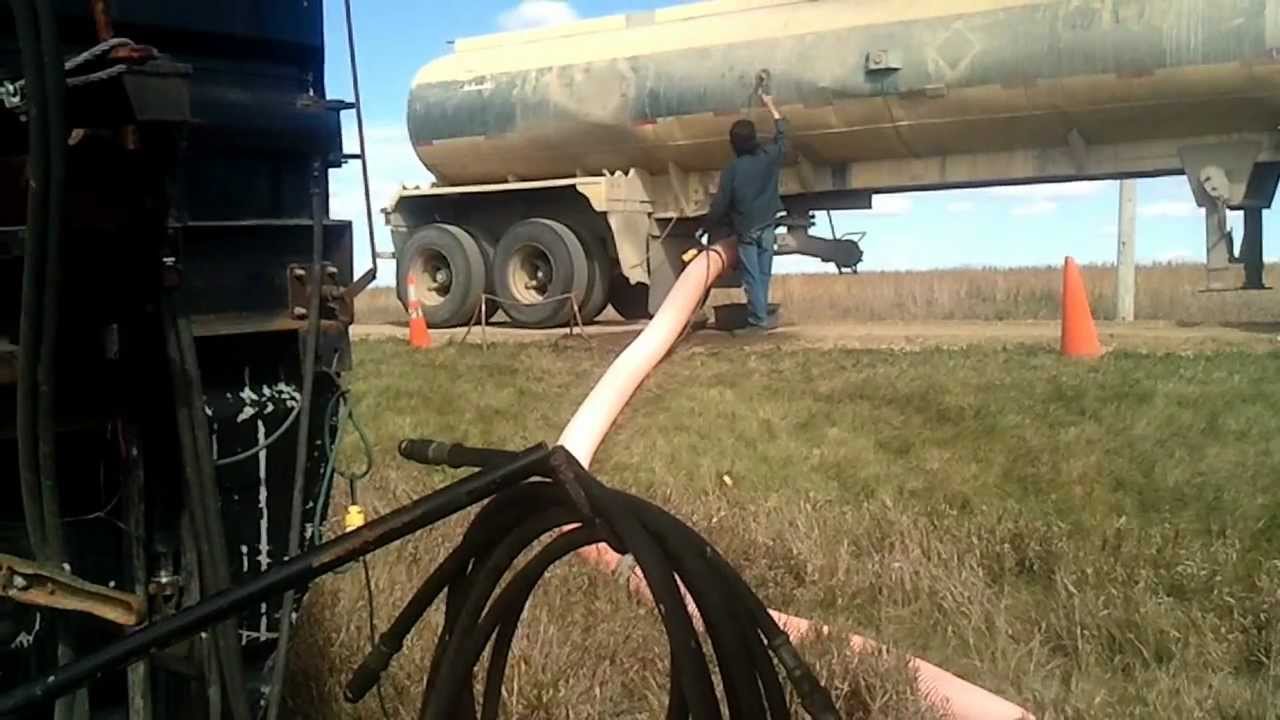 Unloading manure tanker with frac tank - YouTube