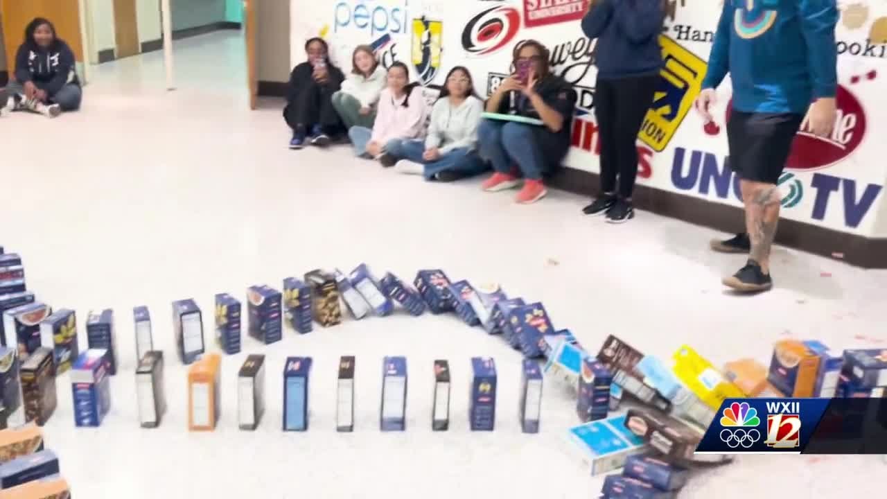 Clemmons Middle School puts on giant game of dominoes using 2,915 boxes ...