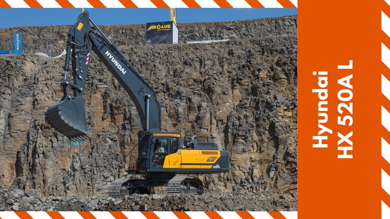 Big Hyundai HX520A excavator loading a new Hyundai HA45A articulated ...