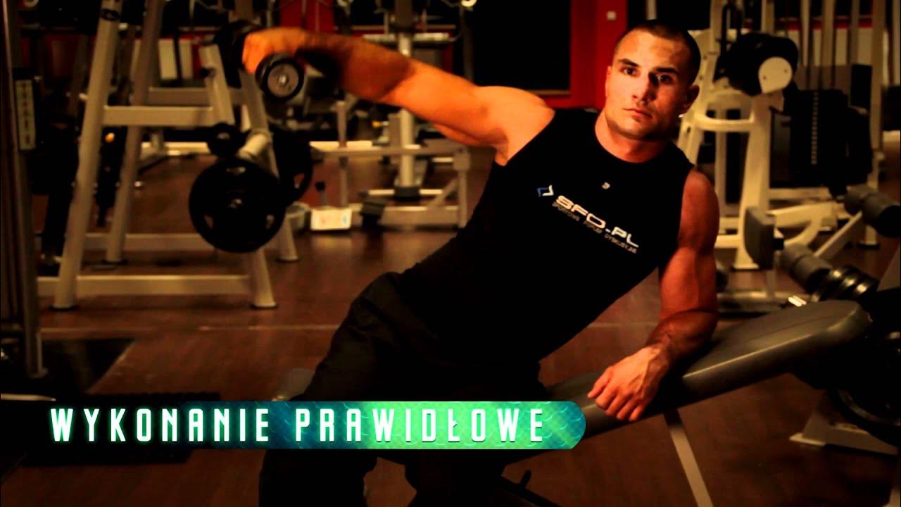 Trening barków - odwodzenie ramienia w bok ze sztangielką, leżąc bokiem na ławce - Atlas Ćwiczeń ...