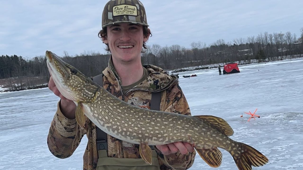 30-inch Pike on WALMART Rod through the ICE!!! - YouTube