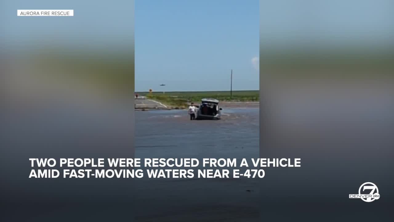 Two people were rescued from a vehicle amid fast-moving waters near E ...