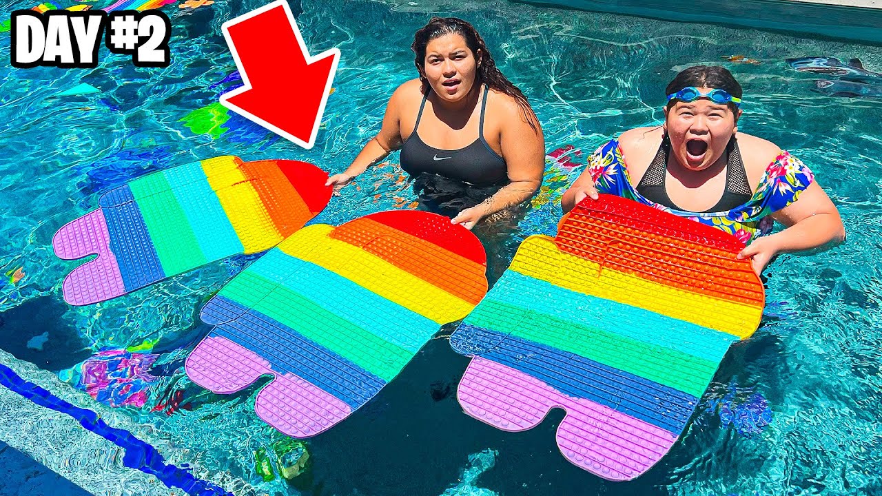 LAST TO LEAVE THE POOL OF FIDGETS WINS $10,000!!! - YouTube