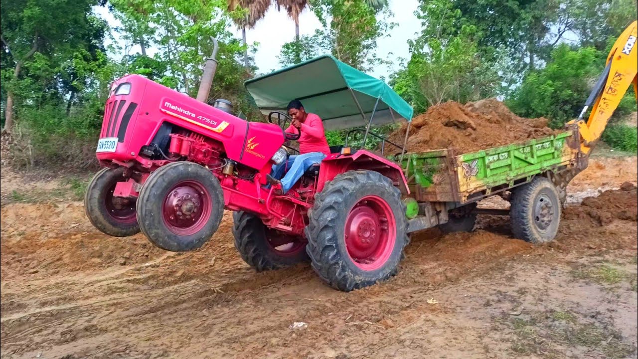 Jcb 3dx Backhoe Loader Machine Loading Red Mud In Mahindra 475 DI ...