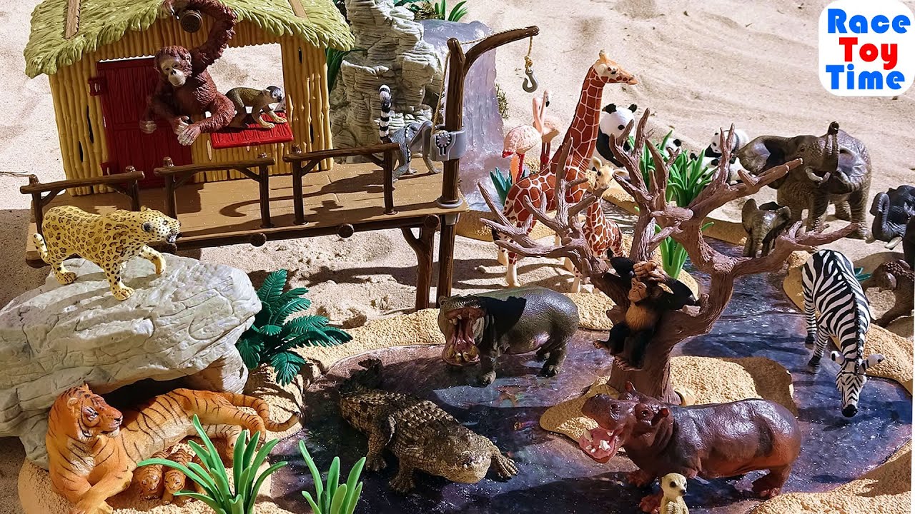 Toy Animal Care Play Sets Plus Wild Animal Toys in the sandbox - YouTube
