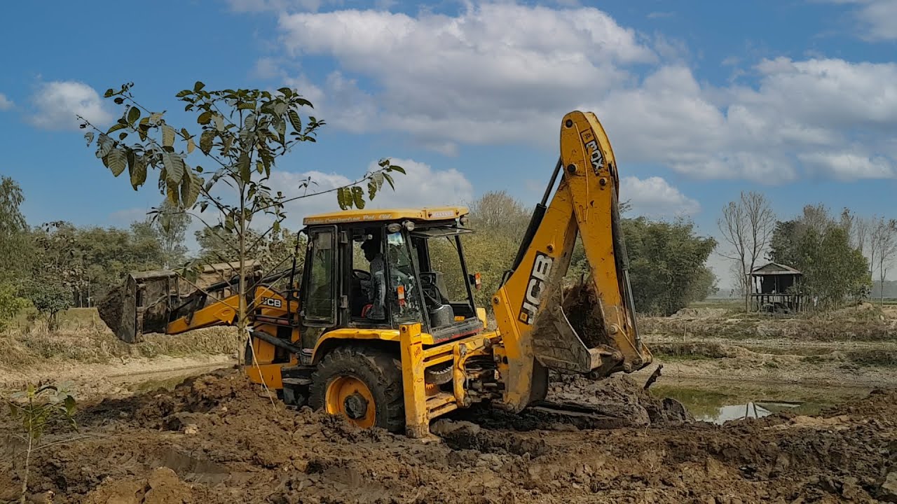 JCB Backhoe in Action: Clearing the Outer Layer for a Pristine Pond ...