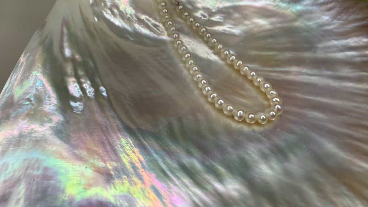 How to string pearls using knotting method for beginners - YouTube