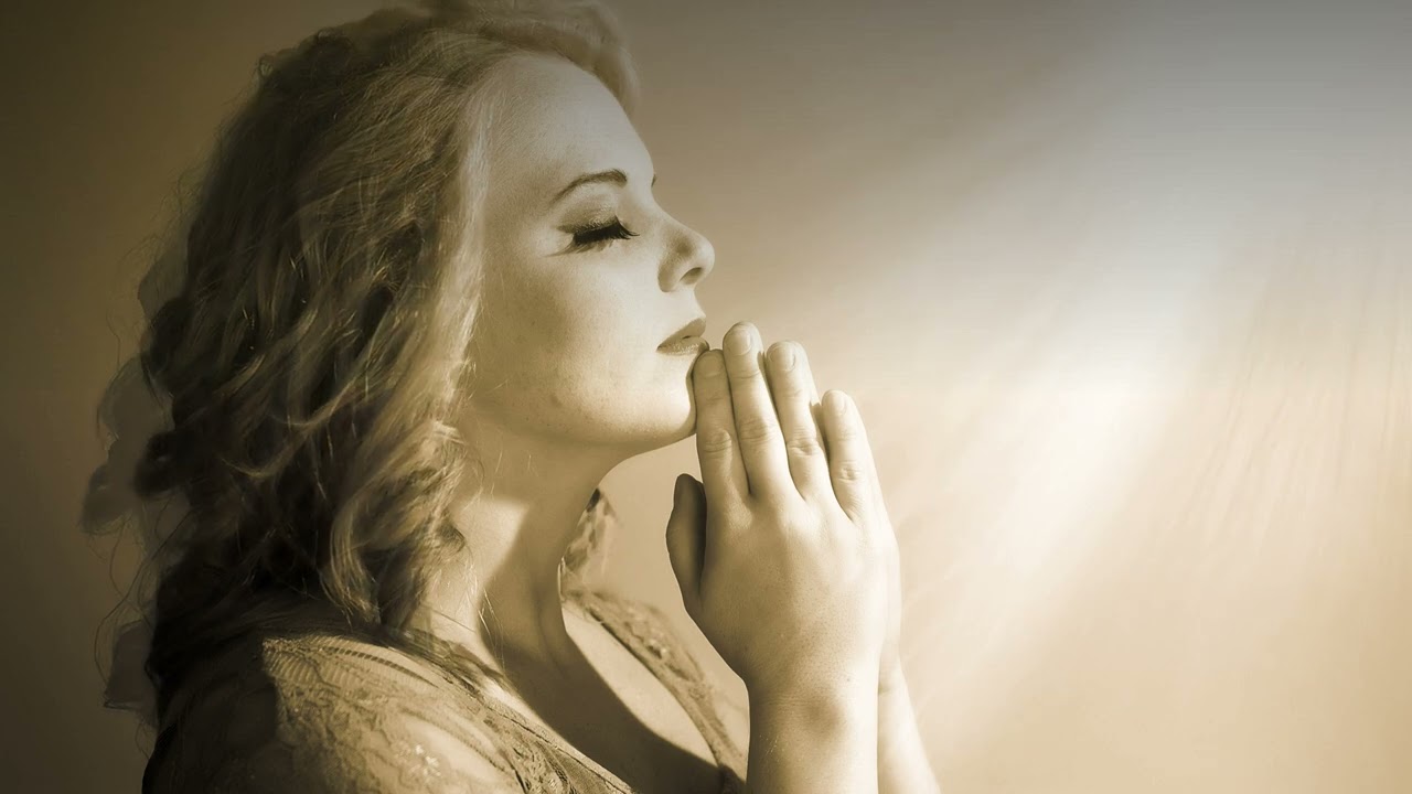 Woman Silhouette With Arm Lifted In Praise And Worship Under Blue ...