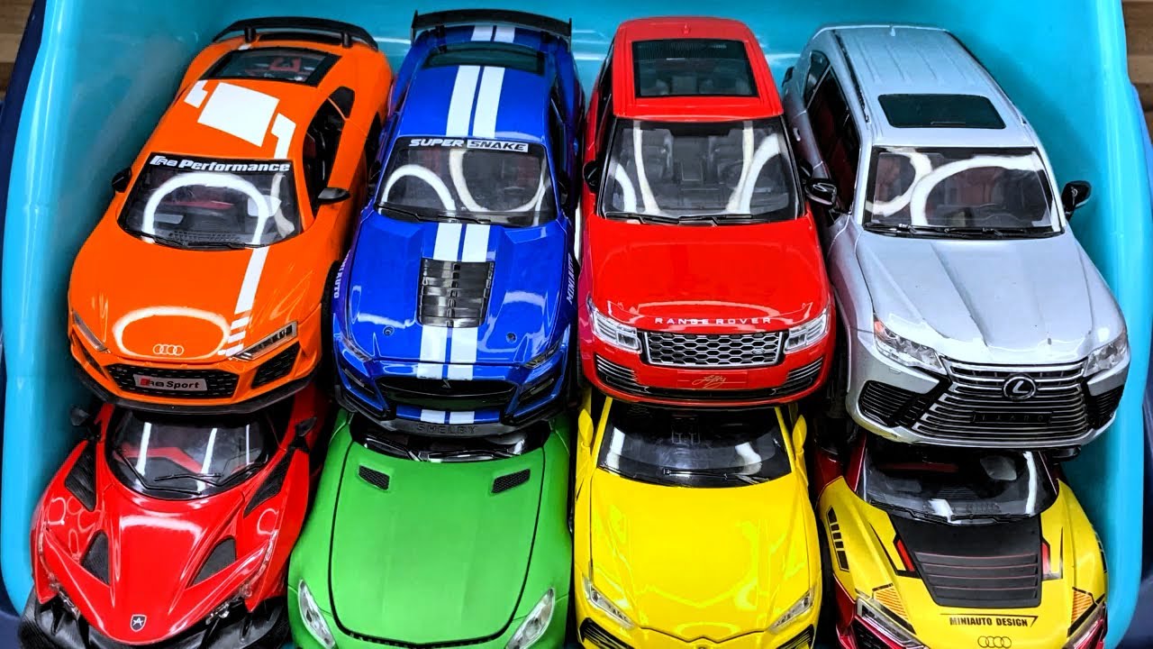 Box full of various miniature cars Jaguar, Peugeot, Renault, Hyundai ...