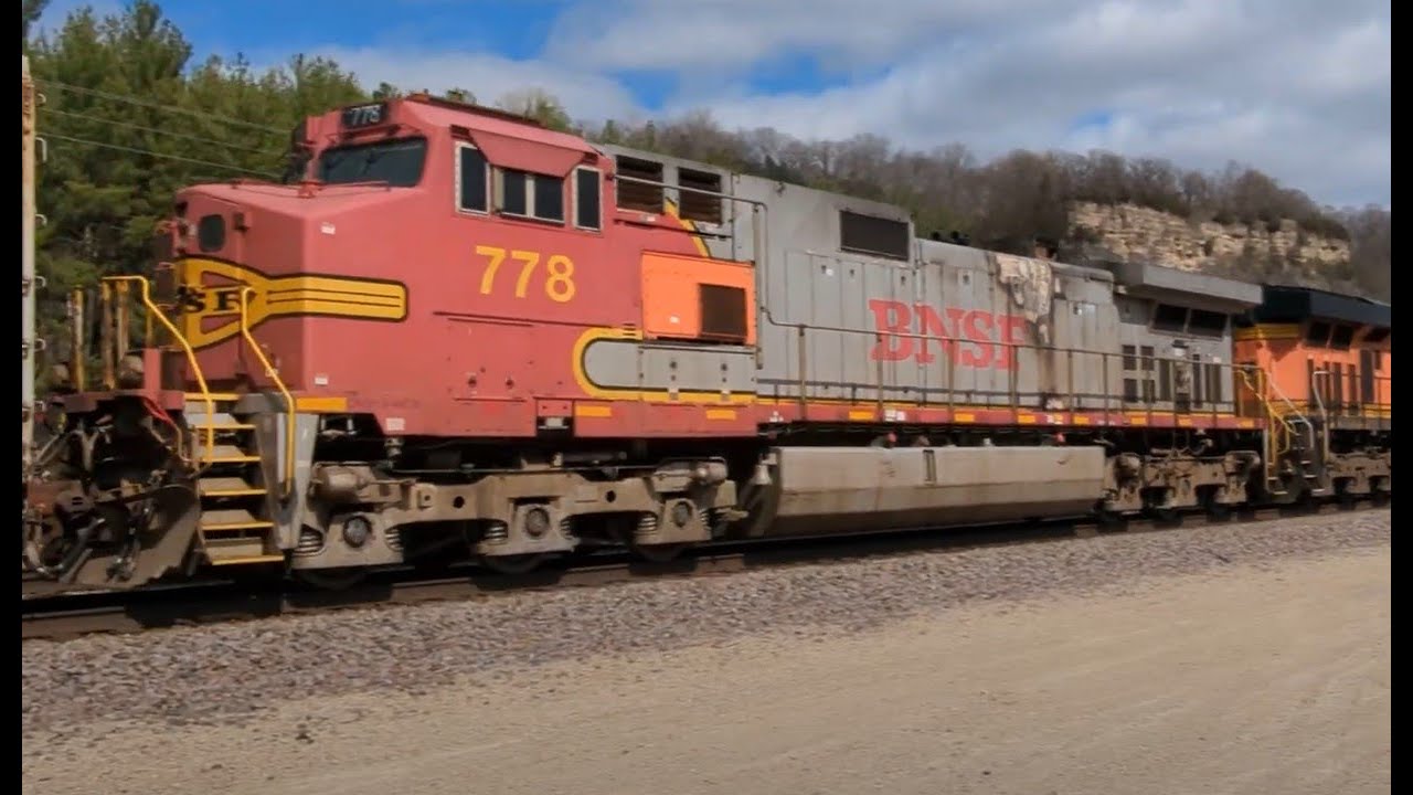 BNSF 778 (BNSF Warbonnet 2nd unit) w/BNSF 6218 (waving crew, slow order) leading X-WMINSL 4/20 ...