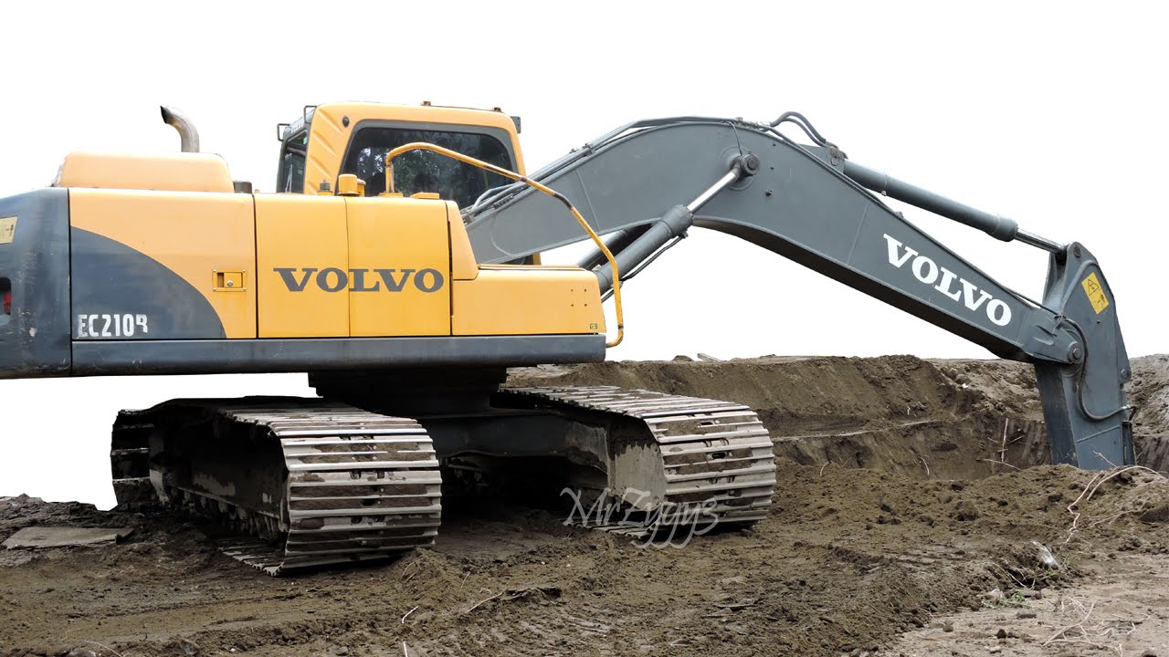 Excavator Digging Dirt Loading Dump Truck Volvo EC210B - YouTube