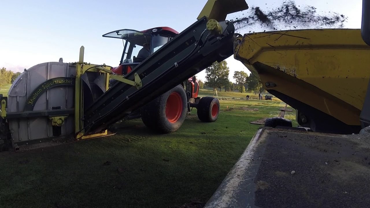 Golf Preservations Inc installing slit drainage - YouTube