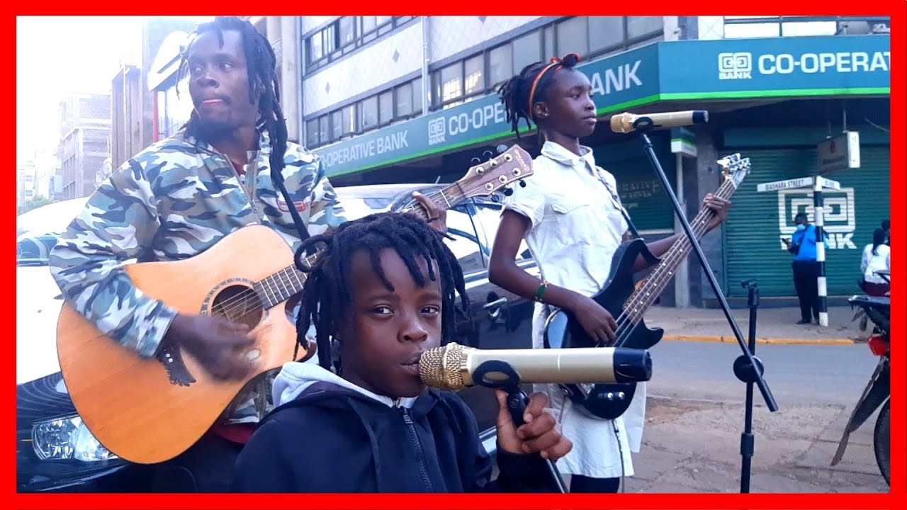 Young Rastafarian Perfoming Reggae Music Alongside Father and Sister In ...