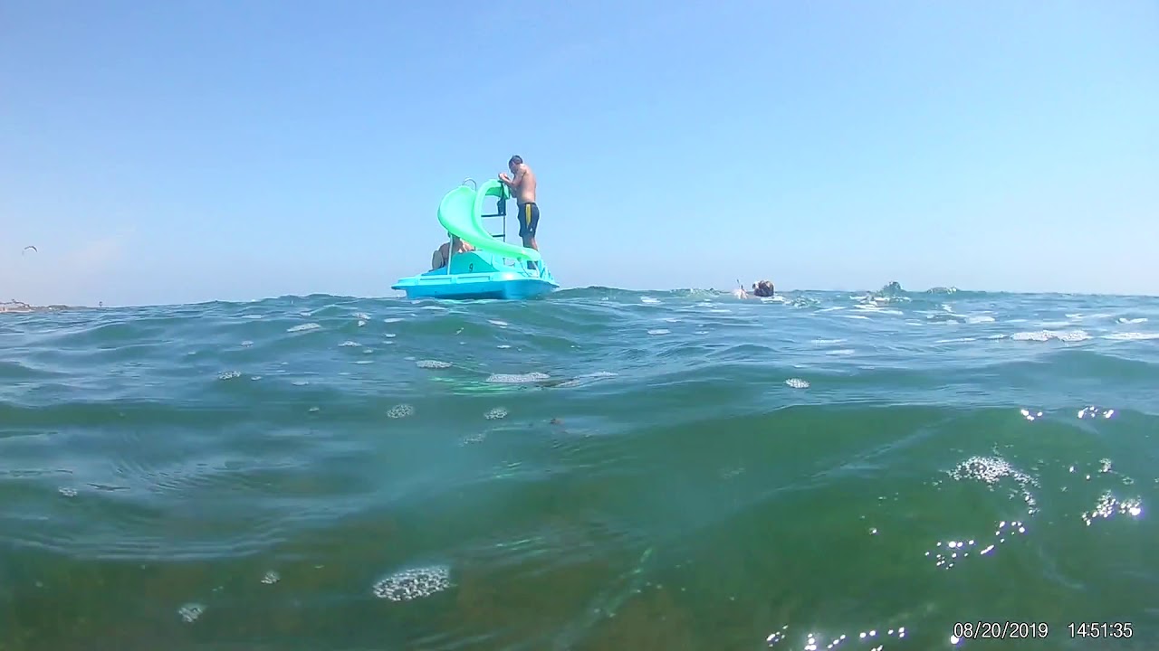 Leah head first down the pedal boat slide - YouTube