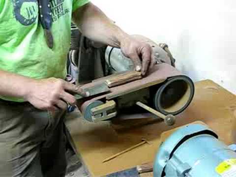 Murray Carter shaping handles on belt sander - YouTube