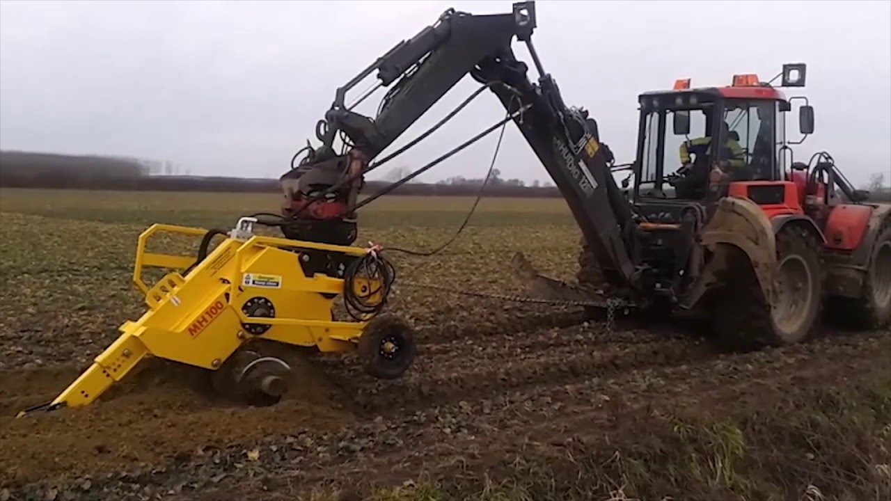 MH100 backhoe mounted hydraulic trencher with soil blades - YouTube