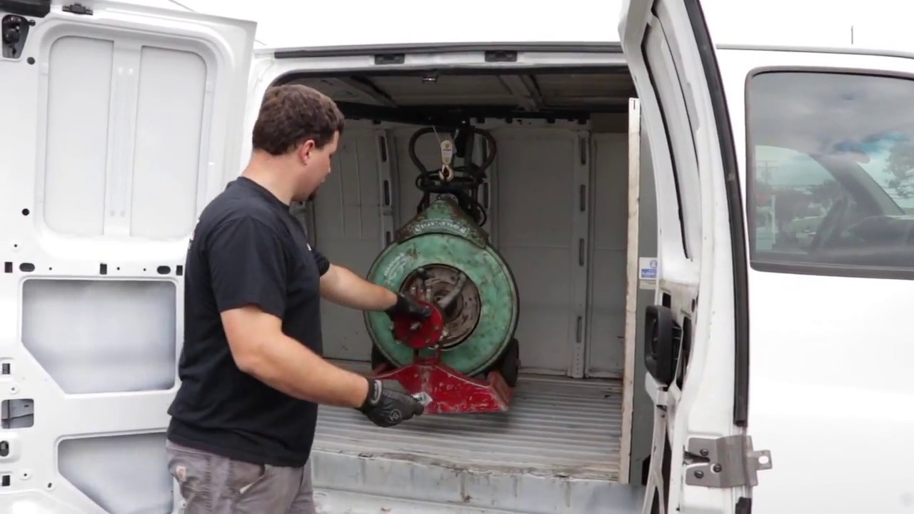 Custom hoists lift sewer cable machines into van - YouTube