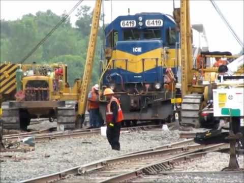 Derailed locomotive gets lifted onto the rails - YouTube