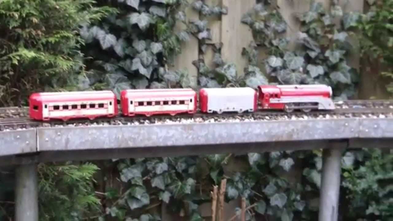 Hafner 0 gauge clockwork trains in the garden - YouTube