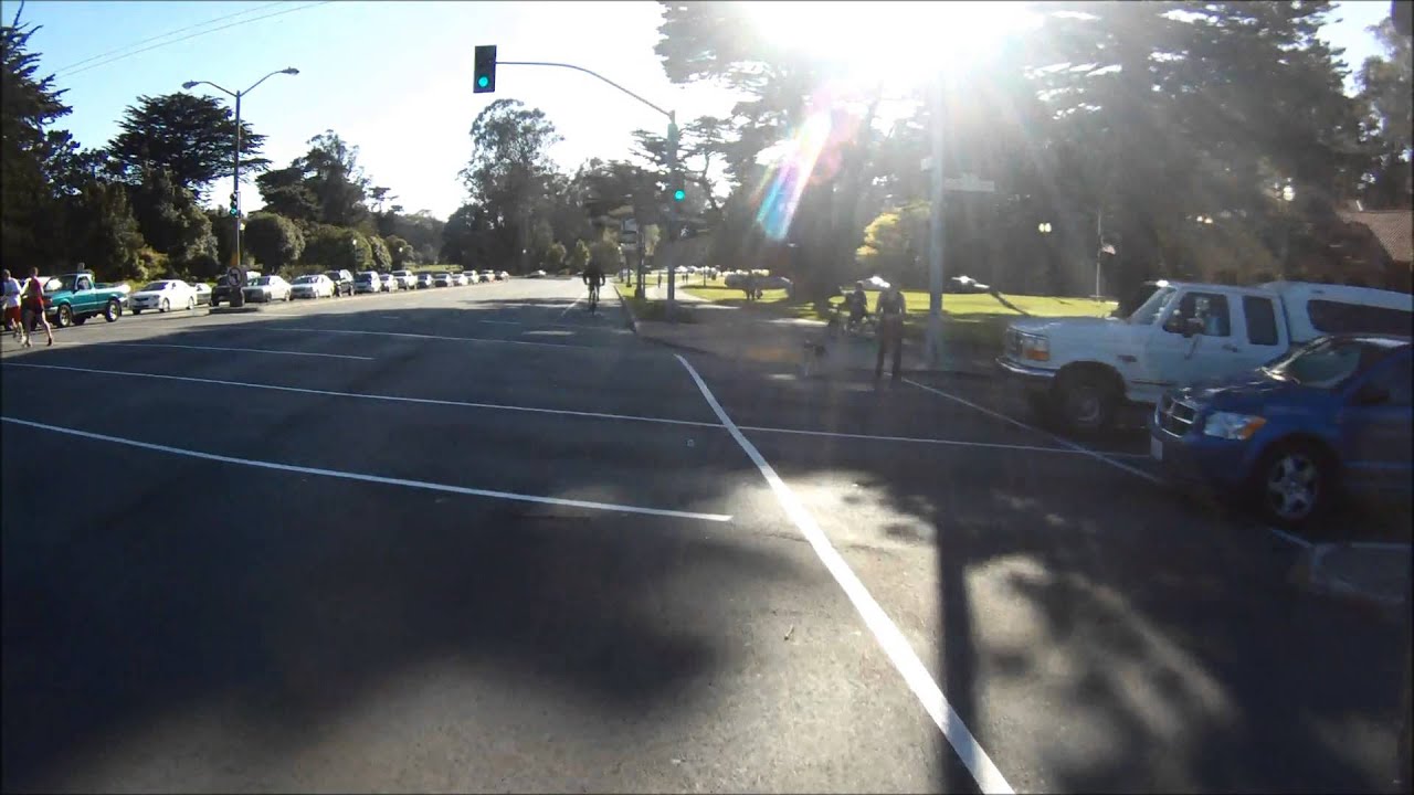 Motorcyclist dangerously lane-splitting bike lane - YouTube