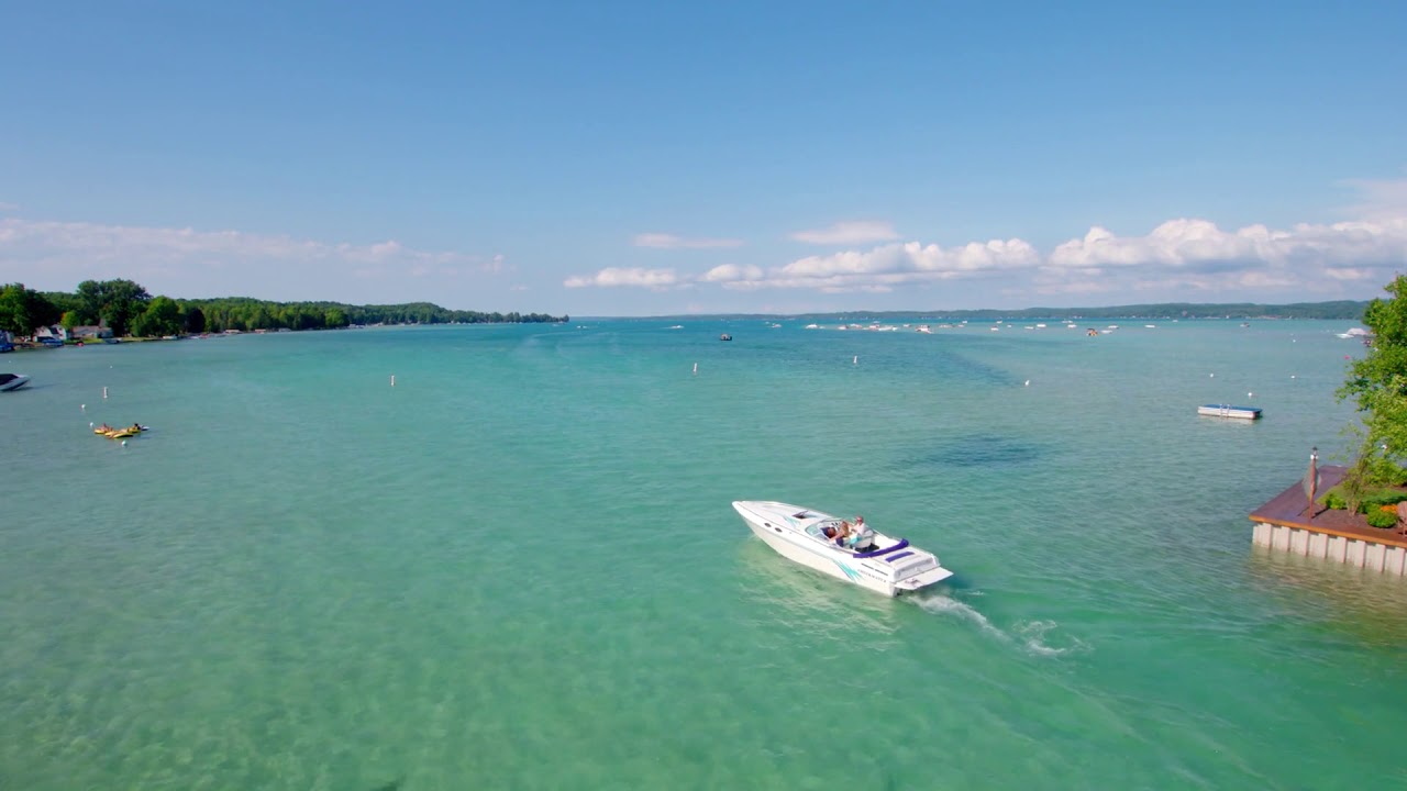 couple in speedboat on torch lake - YouTube