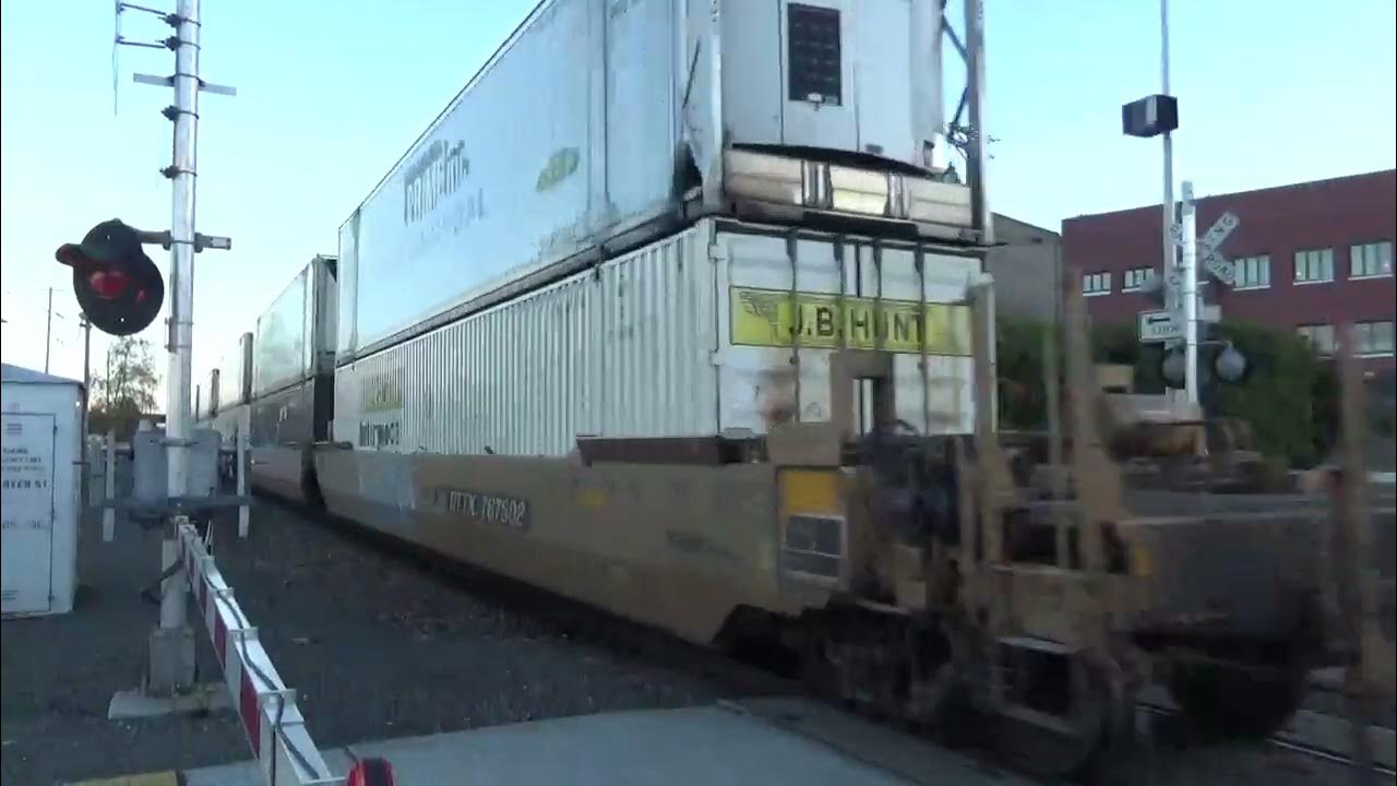 (Southbound) BNSF Intermodal / Autorack Train passes through the McCarver Street Railroad ...