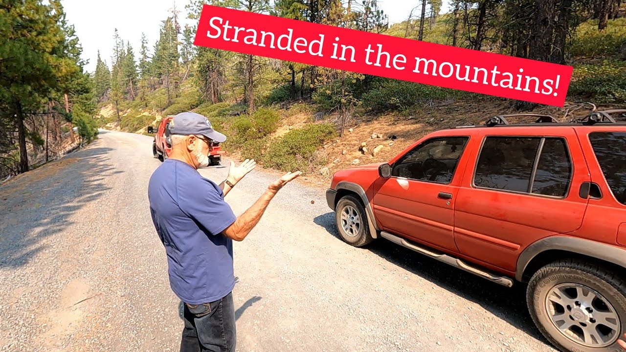Nissan stranded in the woods, 4x4 tow truck to the rescue! - YouTube