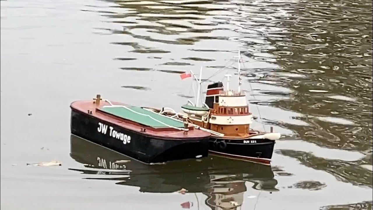 Sun XXI hip towing a barge - YouTube
