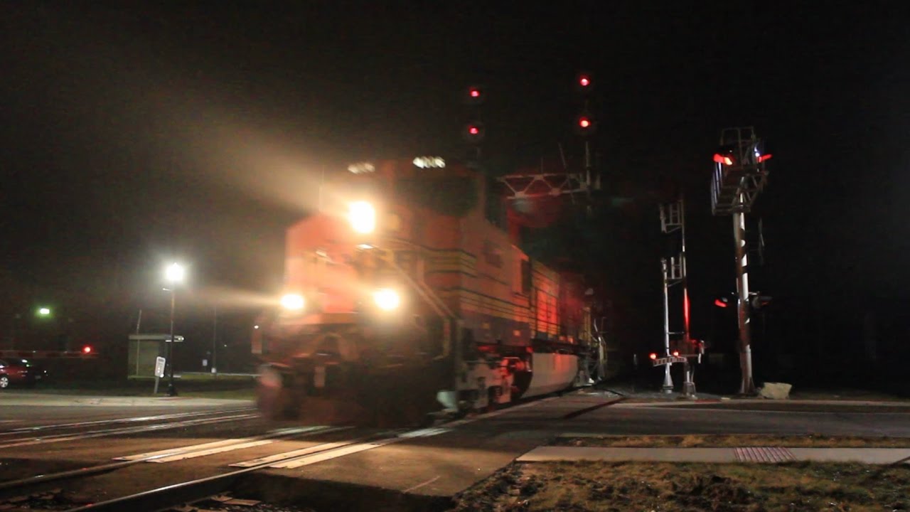 BNSF C44-9W 4006 & CSX SD50-2 8667 head south under the old C&O ...