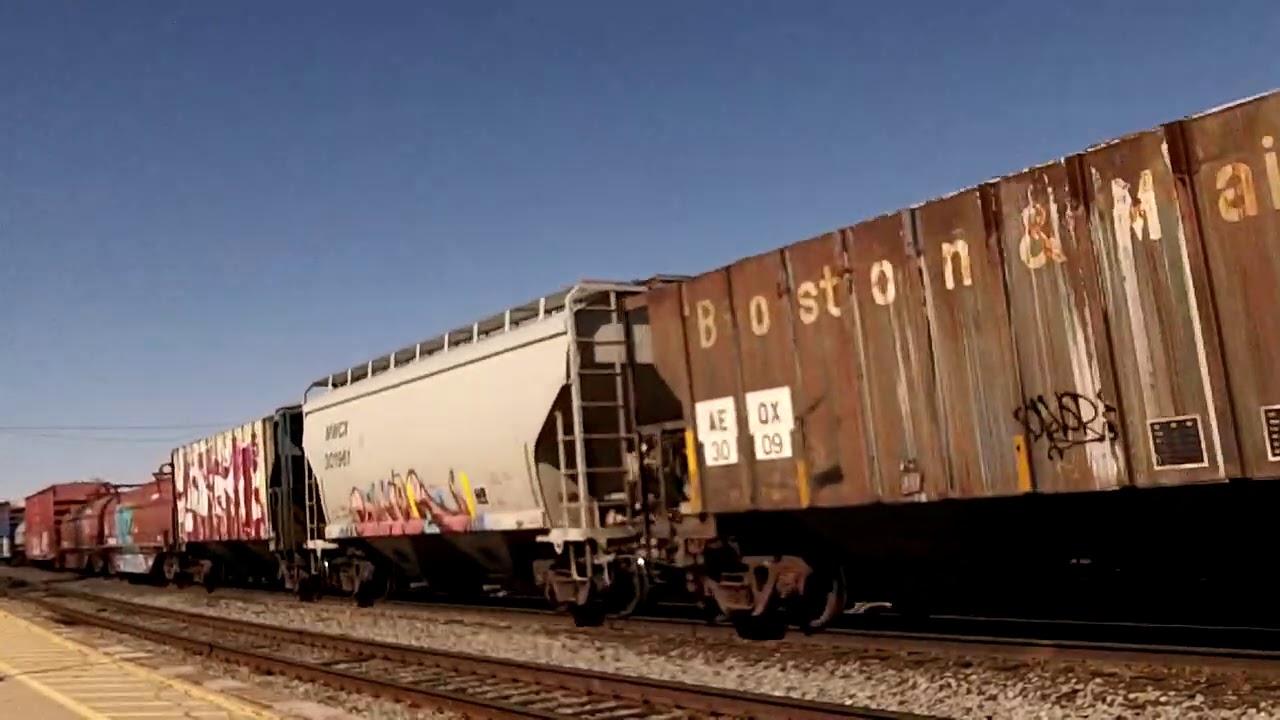 CN 394 w/ CN Engines 2841 & 3189 hooked E.S. lead this long 722 axle ...