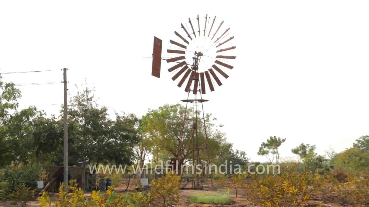 Wind mill, Gujarat - Renewable energy for rural India, combination of ...