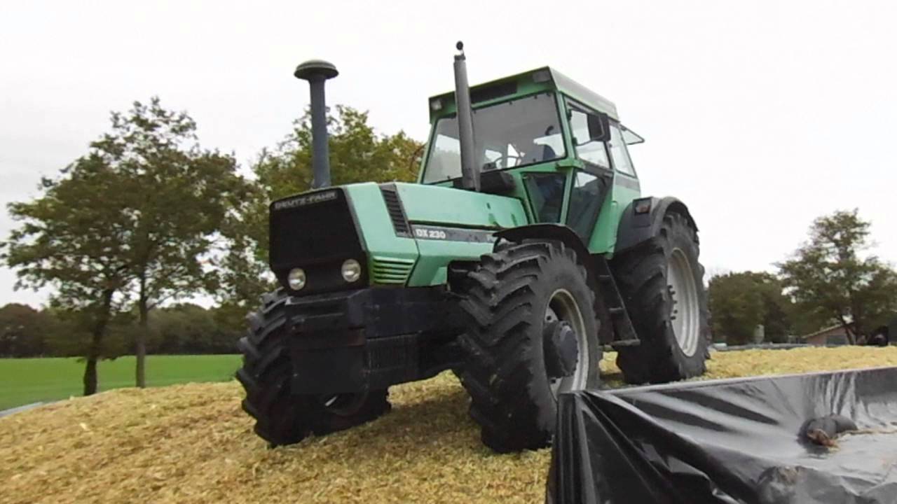 Deutz DX230 compacting silage pit. - YouTube
