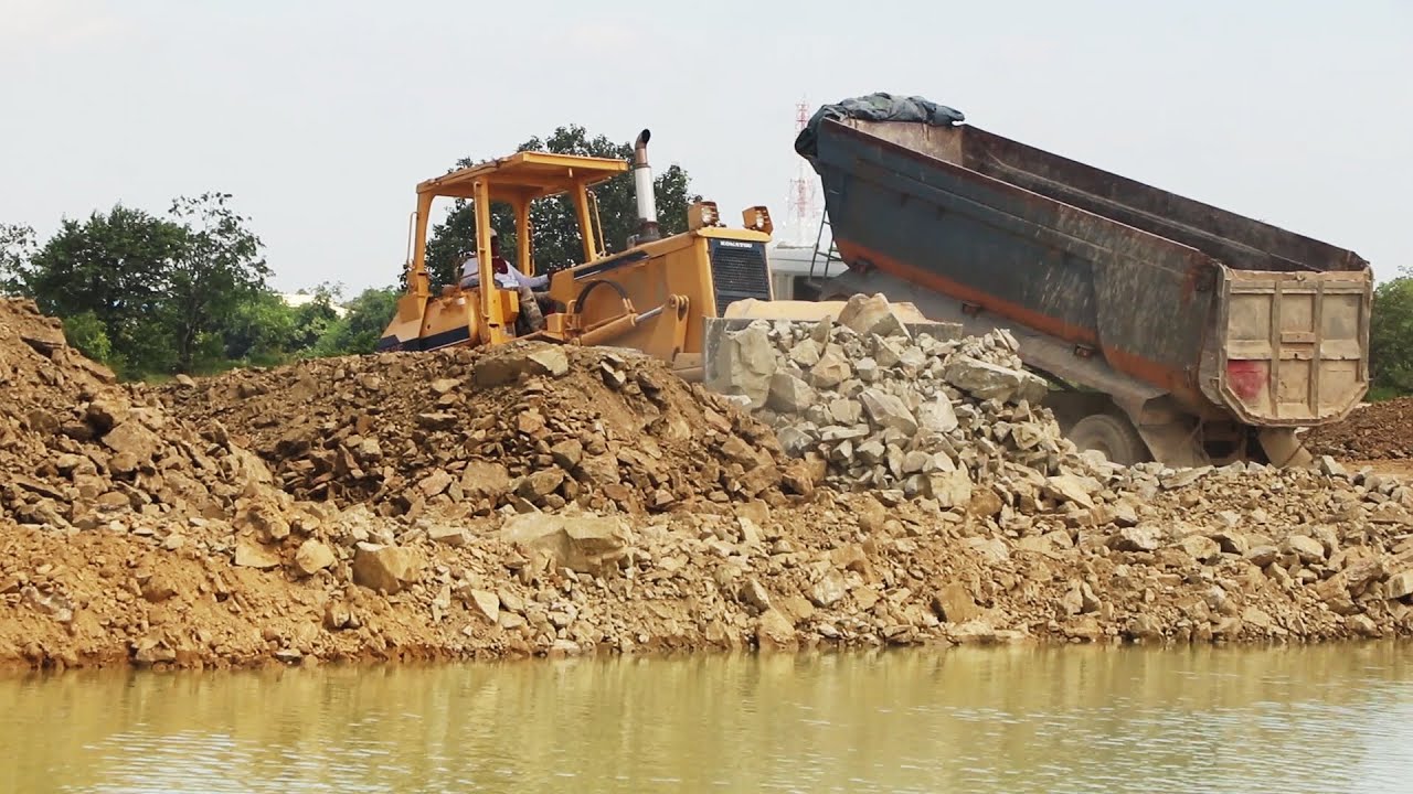 Awesome construction machines big dump truck and bulldozer filling big ...