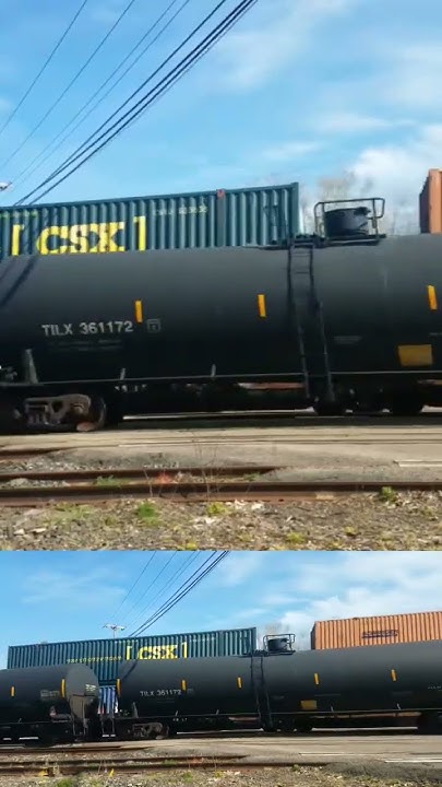 CSX train meets BNSF oil tanker train at the railroad crossing. - YouTube