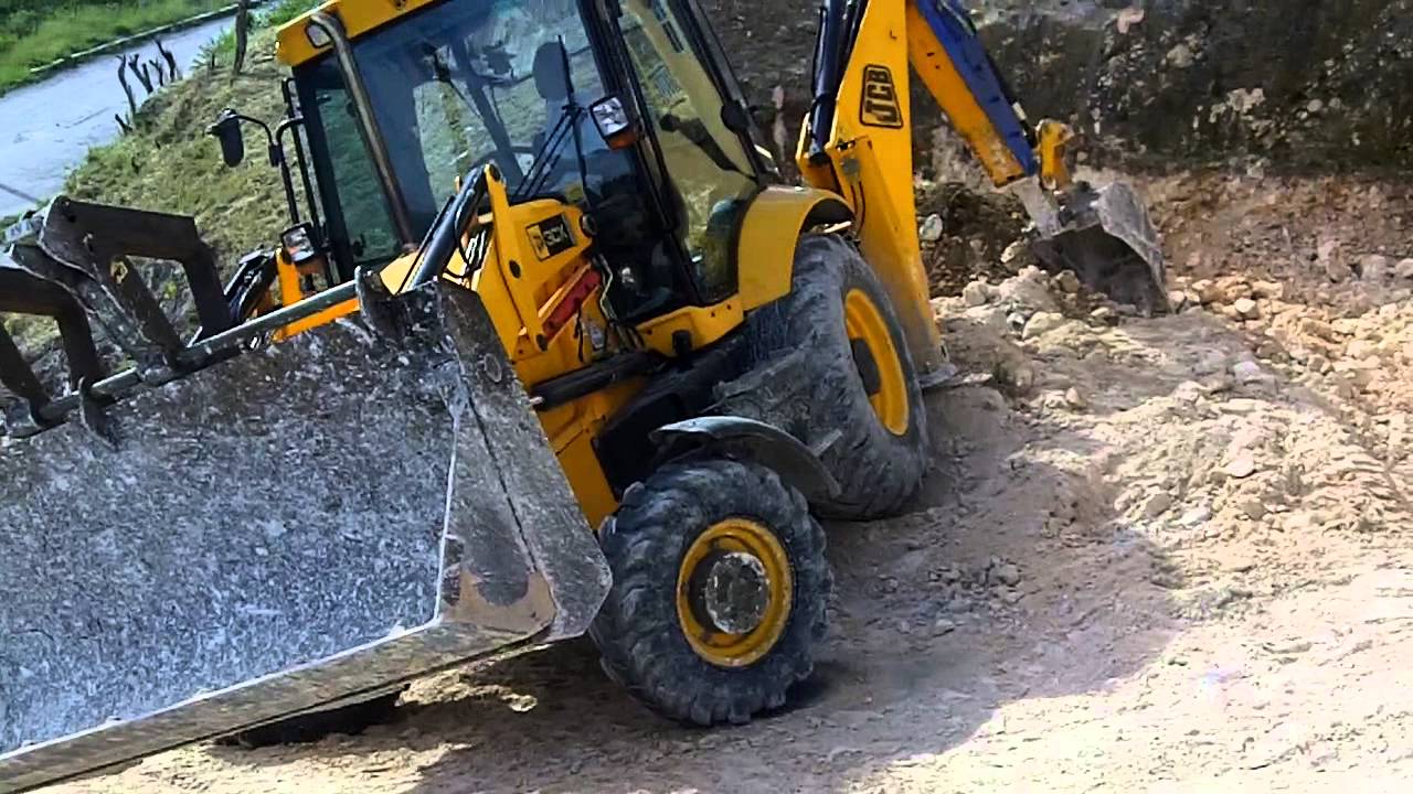 JCB Backhoe In A Tough Spot On Hill Side And Stuggles To Get Out - YouTube