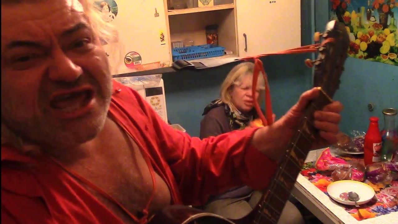 Russian Elvis Presley sings with a girl fan in a luxurious kitchen ...