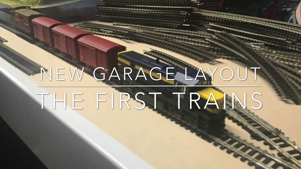 New ho model railway garage layout: The first trains - YouTube