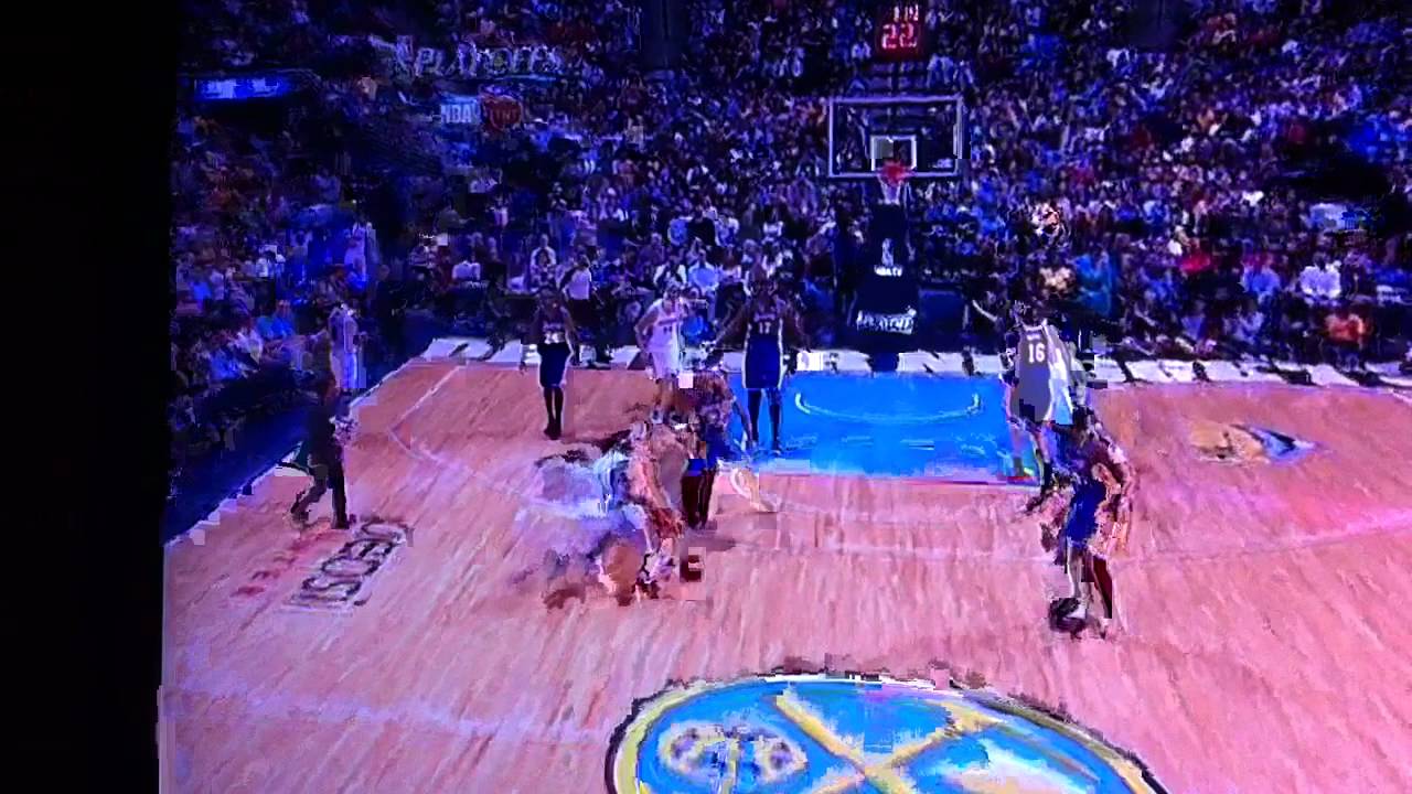 Crazy Lady fan on the basketball court. Denver Nuggets vs. Los Angeles ...